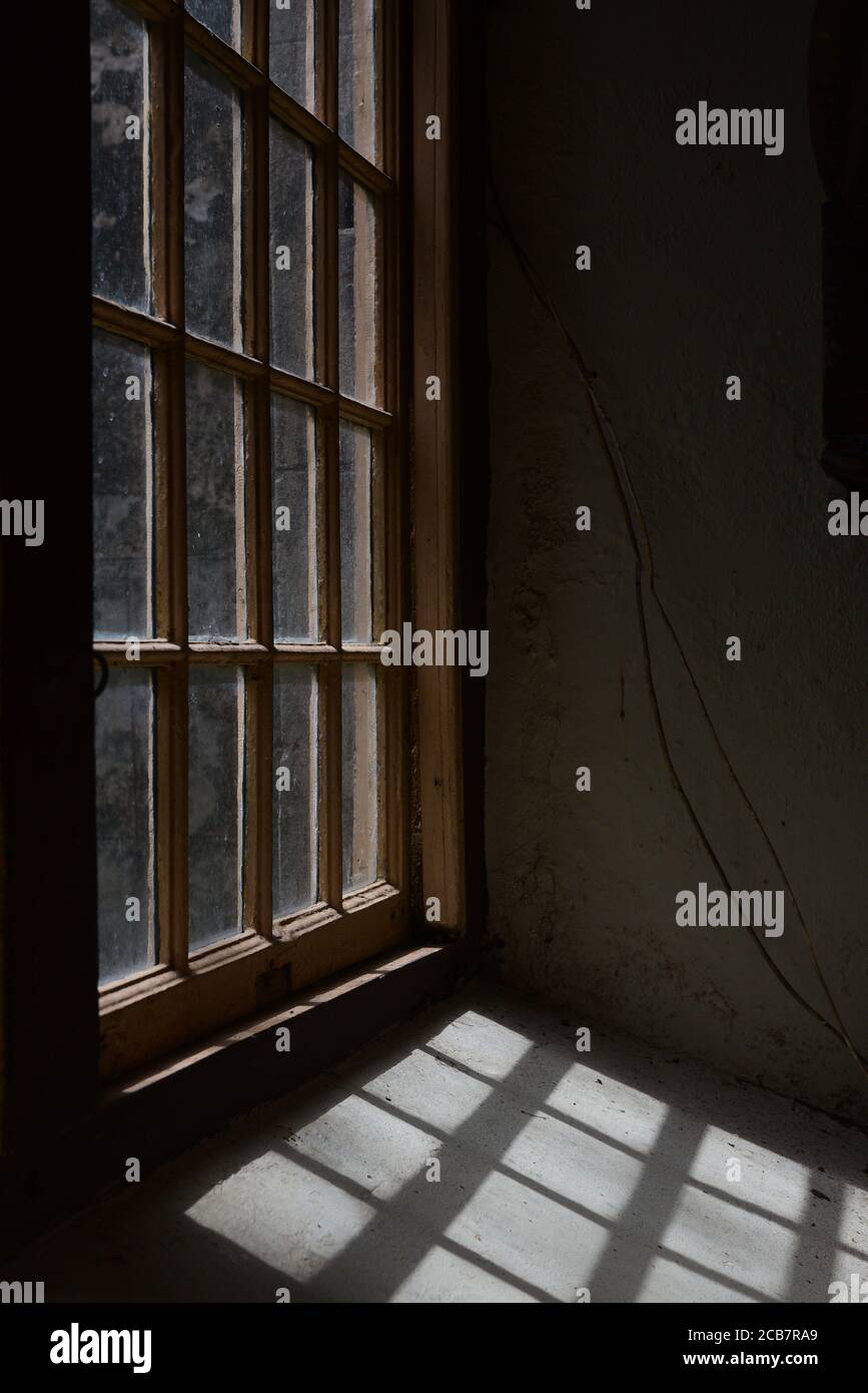 Oblique view of sunlight through an old dusty window Stock Photo - Alamy