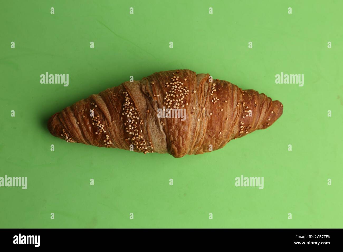 Closeup shot of a delicious croissant on a green background Stock Photo ...