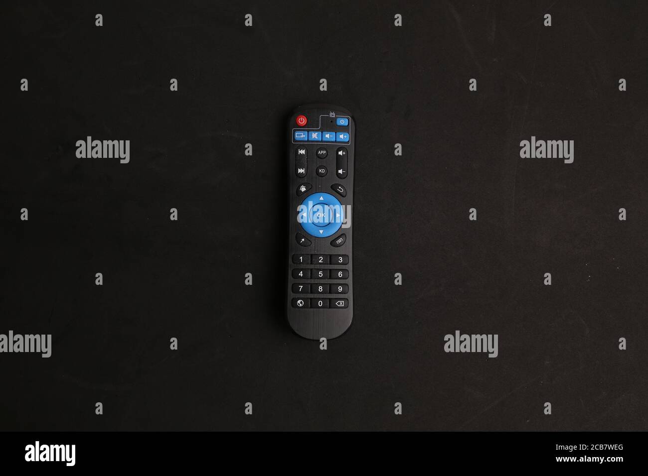 Top view of a TV remote control on a black background Stock Photo - Alamy