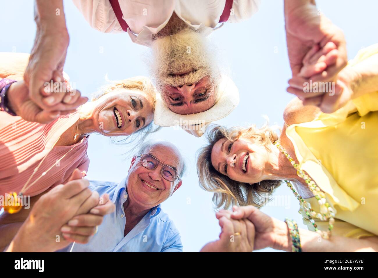 Group of seniors making a picnic at the park and having fun Stock Photo ...