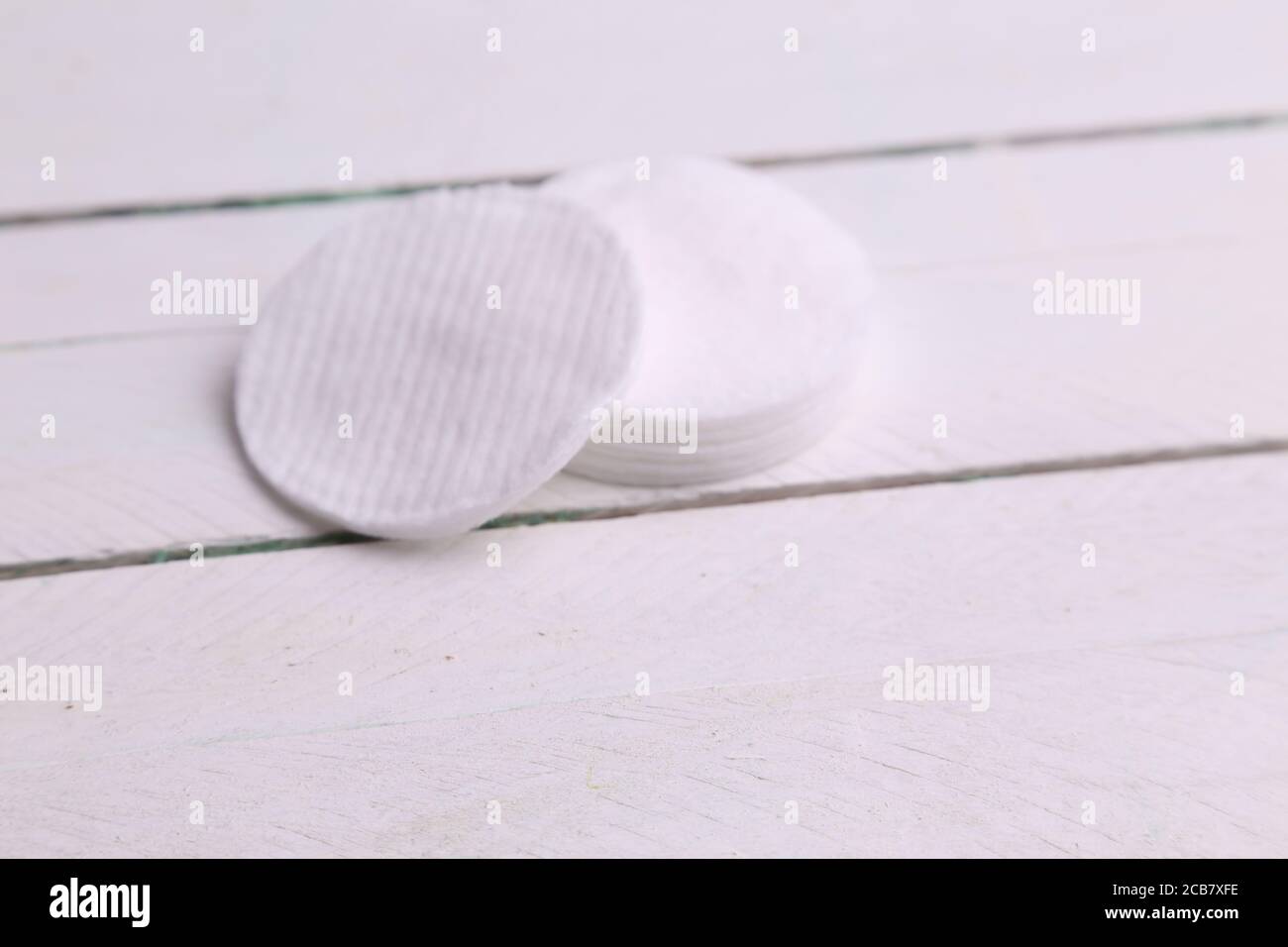 Circle cotton pads on a white wooden surface Stock Photo - Alamy