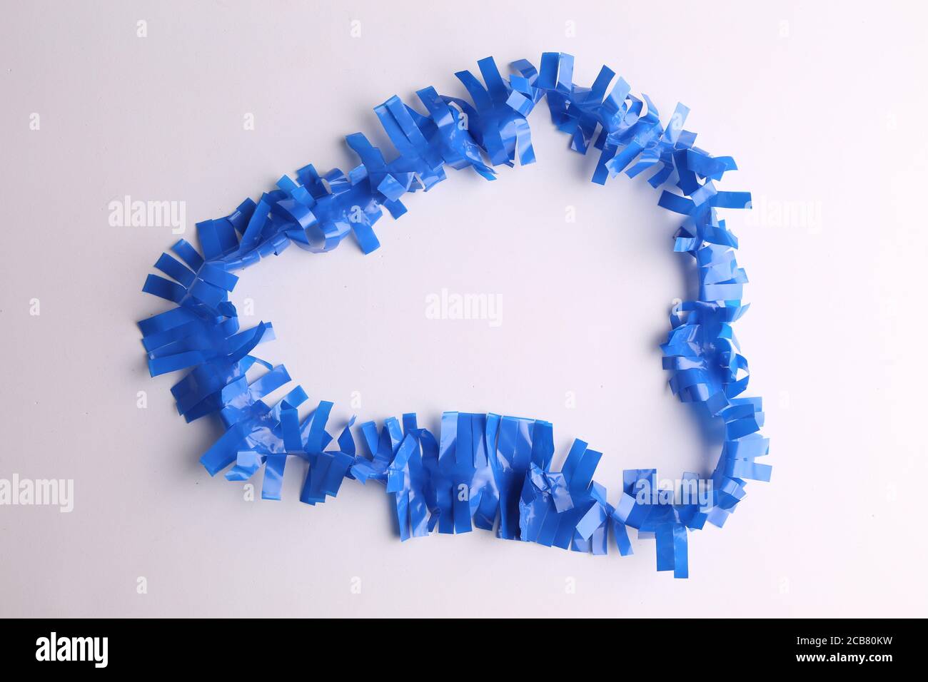 Closeup shot of blue party ribbon on white background Stock Photo - Alamy