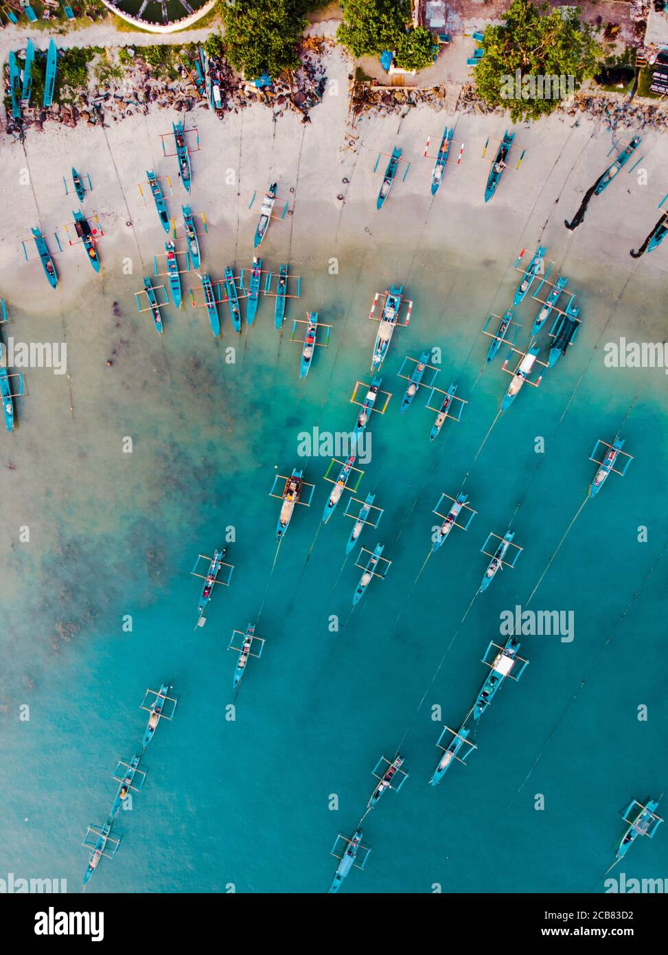 Aerial view of traditional fishing boats on beach and anchored at sea ...