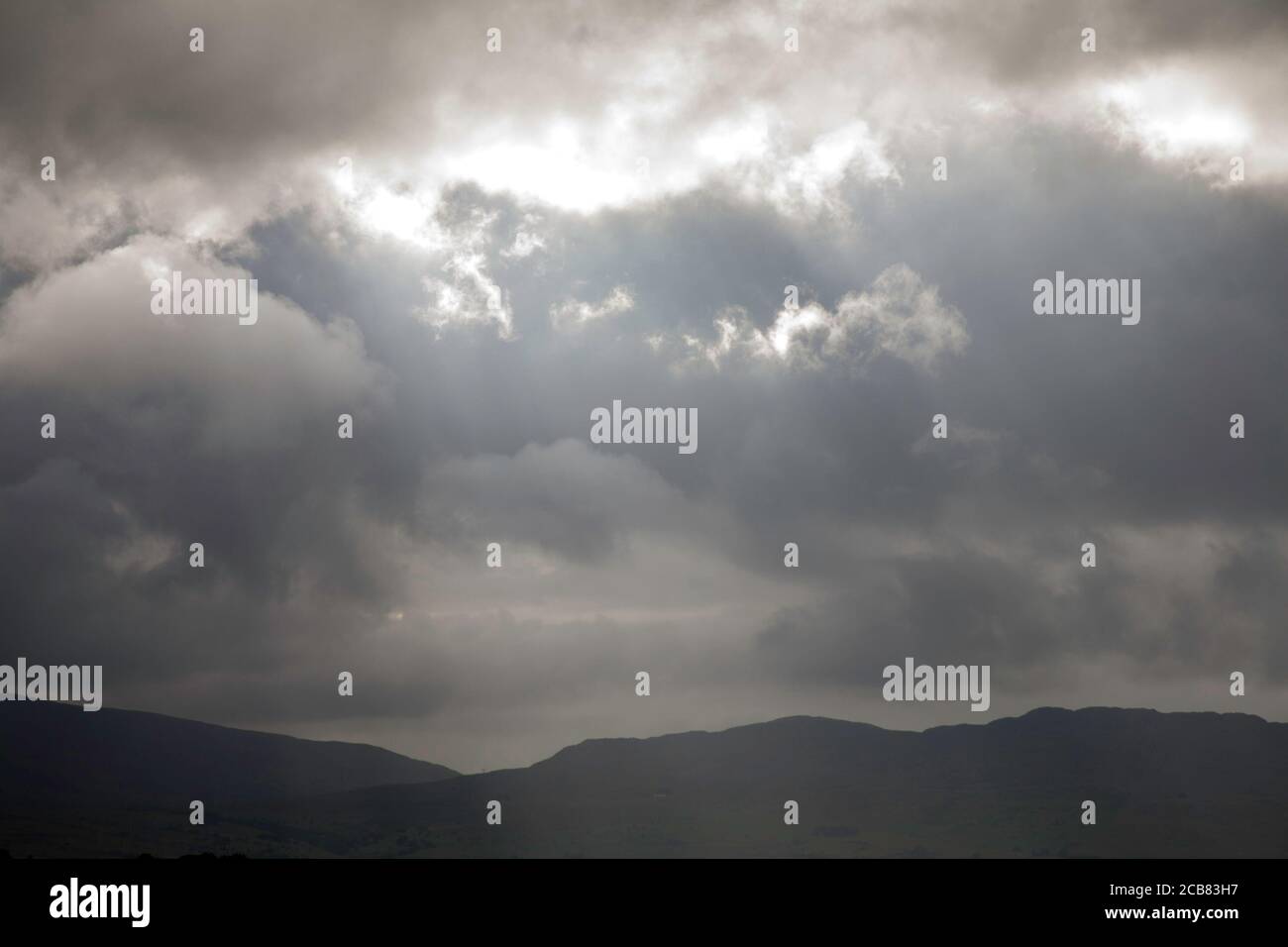 Storm clouds passing across the mountains along the Vale of Conwy ...