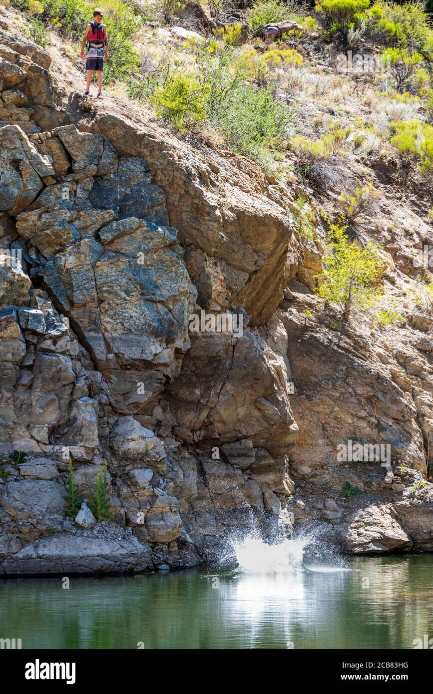 Boy jumping off cliff hi-res stock photography and images - Alamy