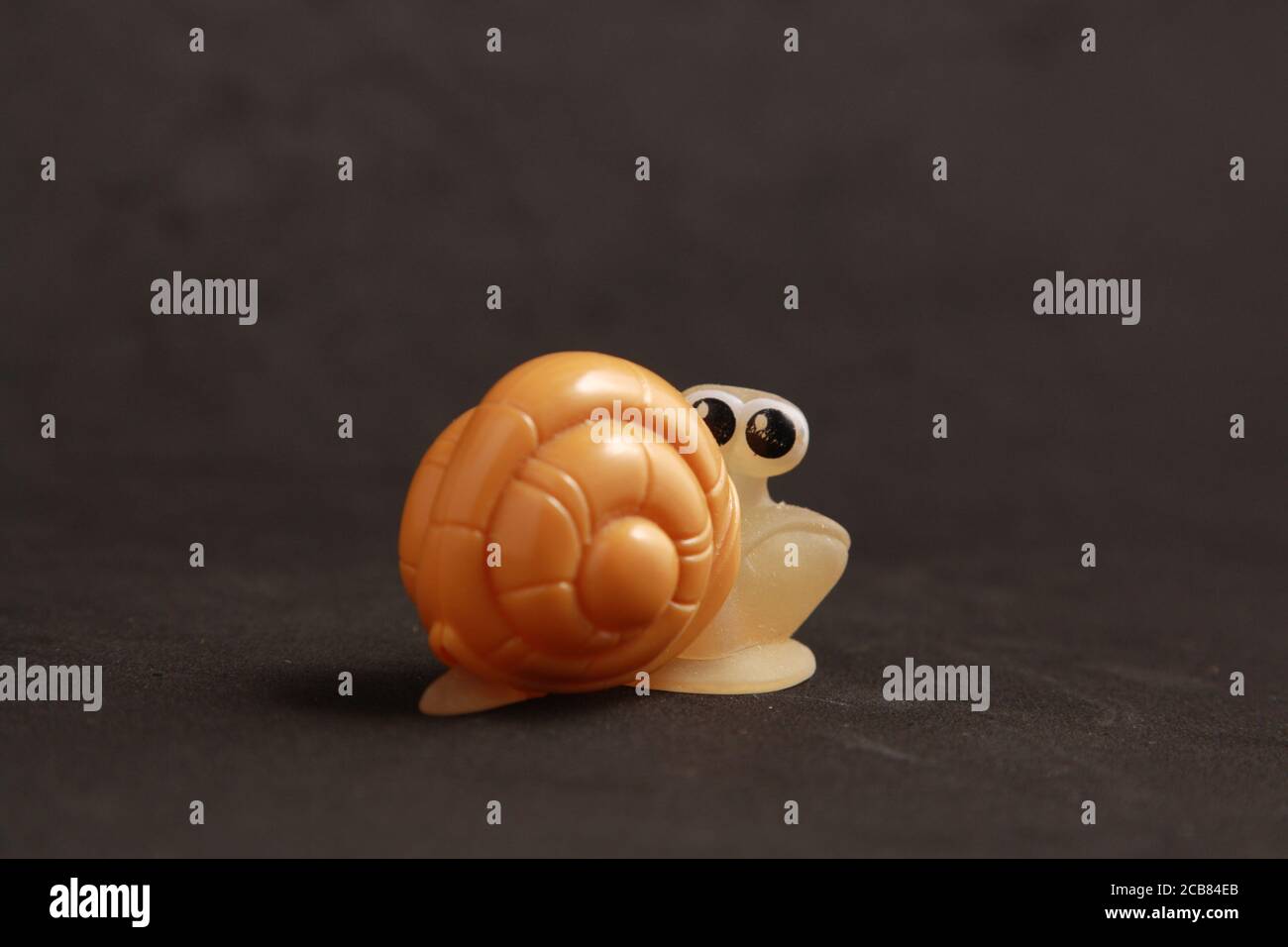Plastic green toy snail hi-res stock photography and images - Alamy
