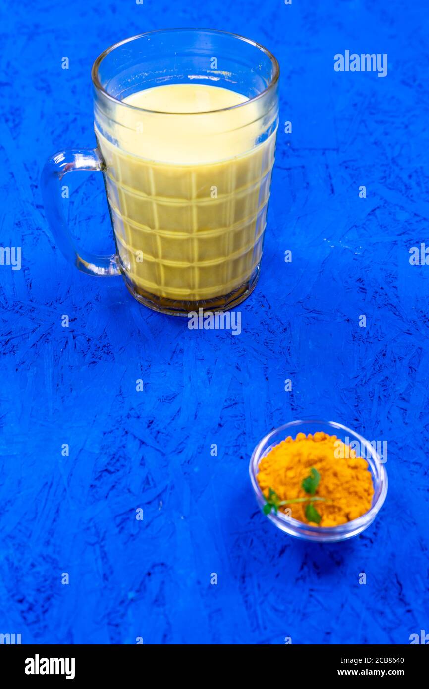 Golden milk in a glass beer mug Stock Photo - Alamy