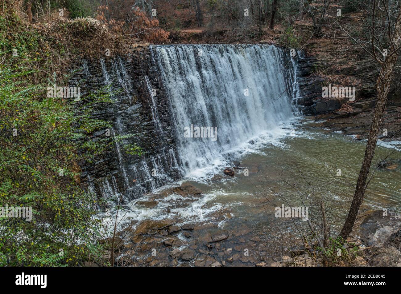 A closeup view looking across from the trail at the waterfall at the ...