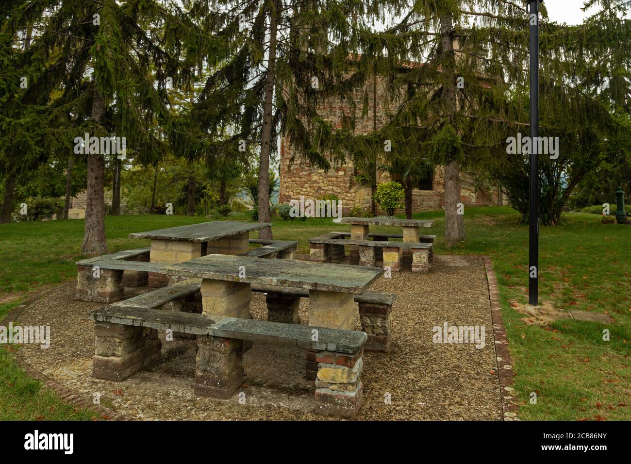 Stone table under the trees Stock Photo - Alamy