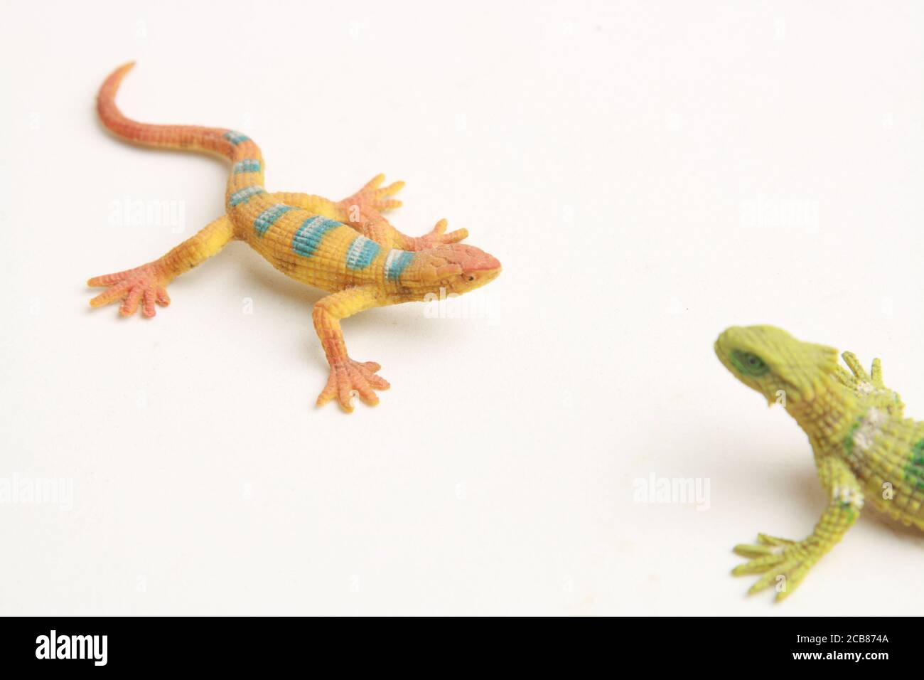 Rubber lizard toy set isolated on a white background Stock Photo - Alamy