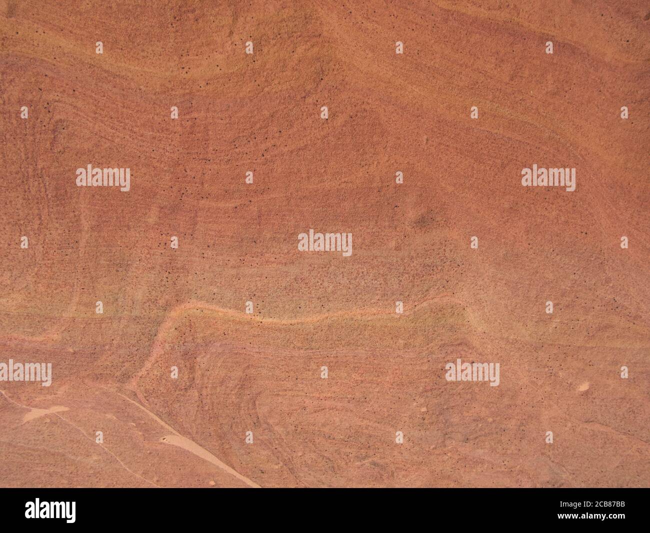 Slightly curved shapes and lines in a red sandstone Stock Photo - Alamy