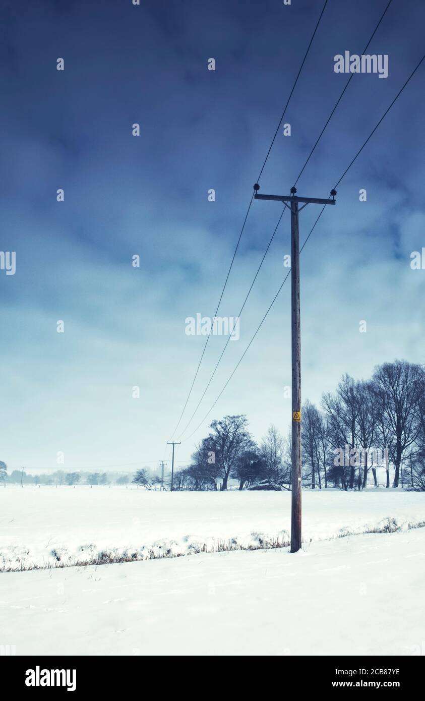 Snow scene with telegraph poles Stock Photo - Alamy