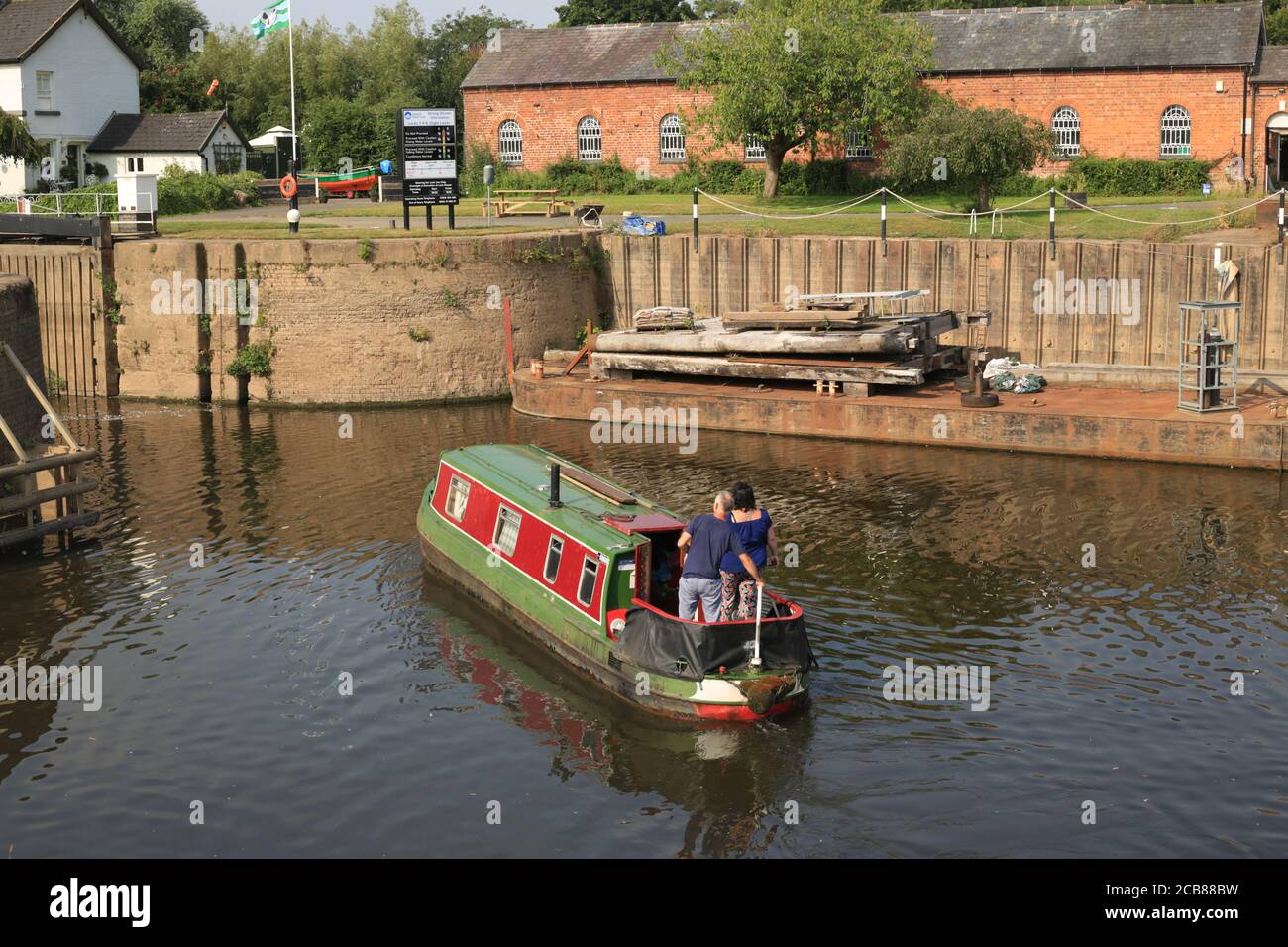 A narrowboat entering Diglis lock on the river Severn in Worcester, Worcestershire, England, UK ...