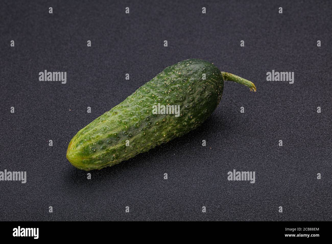 Green ripe fresh one cucumber over background Stock Photo - Alamy