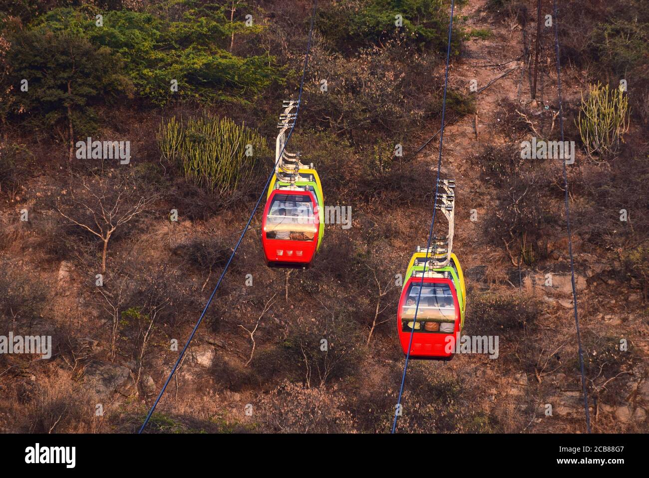 A ropeway trolley is carrying the devotees of Goddess Mansapurna Karni ...