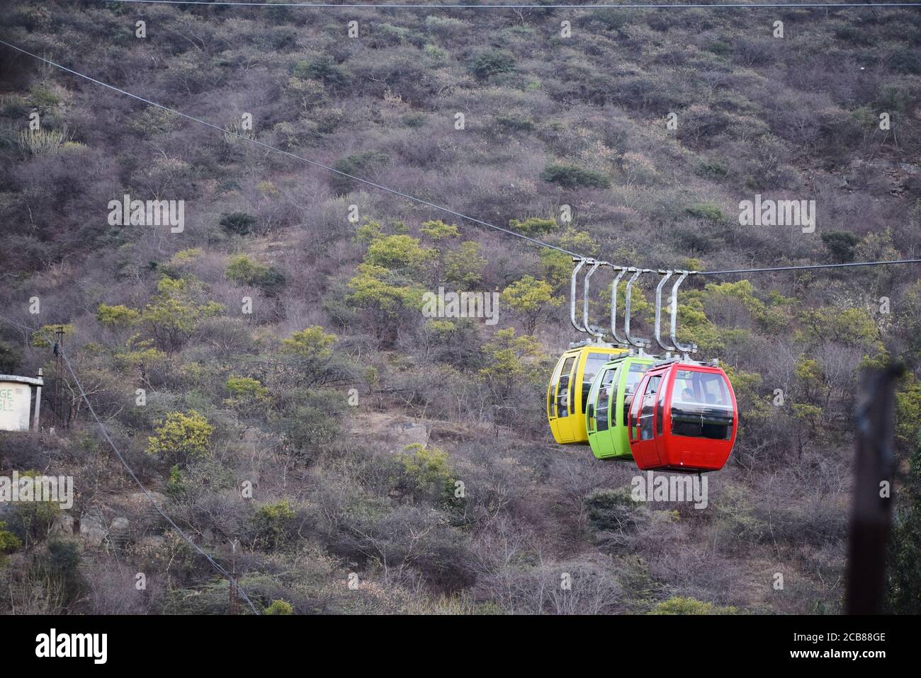 A ropeway trolley is carrying the devotees of Goddess Mansapurna Karni ...