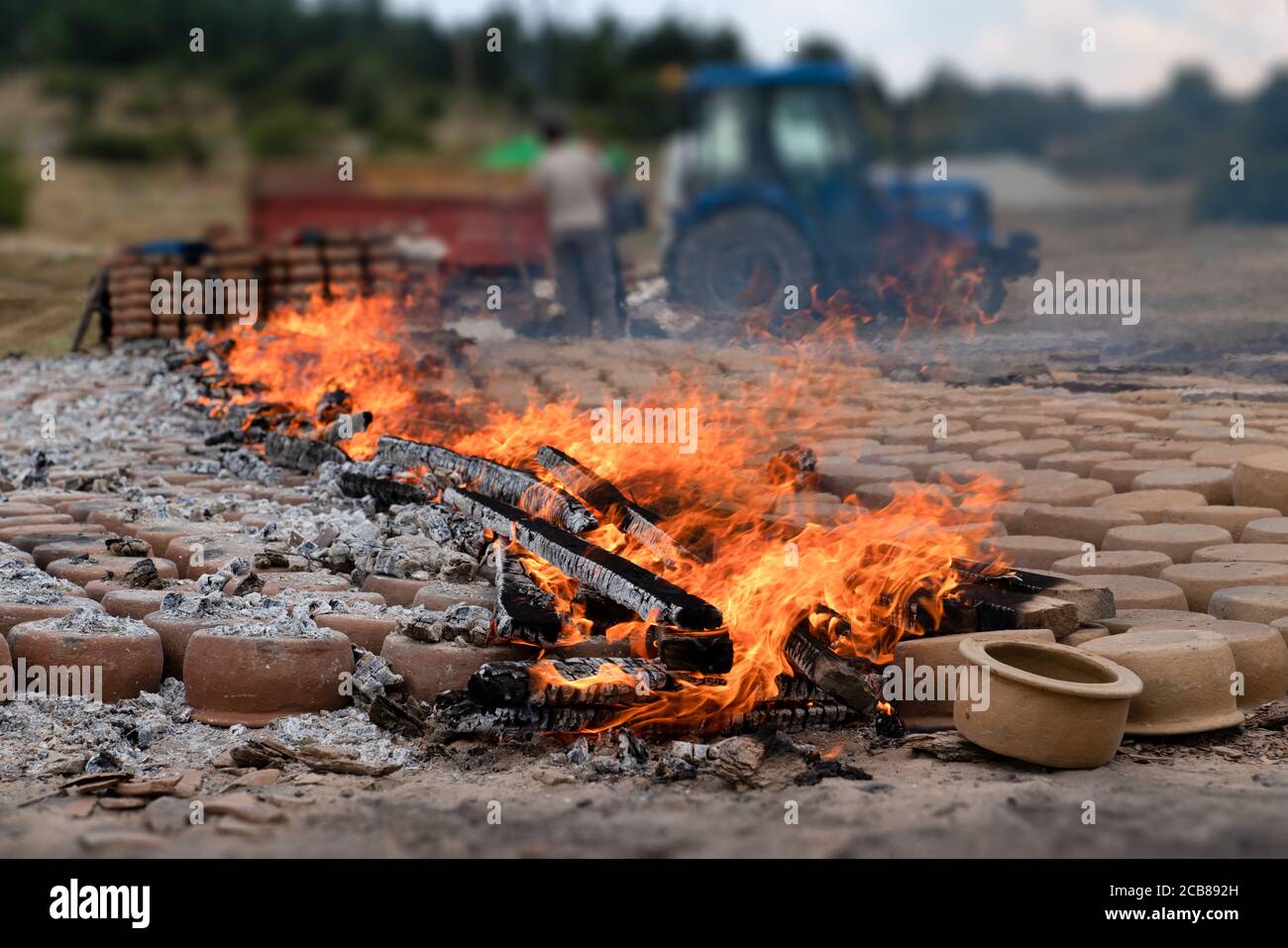 Drying clay pots on fire Stock Photo - Alamy