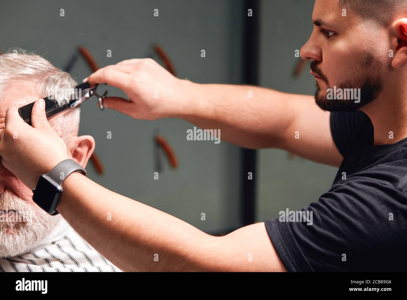 old man being cut by experienced stylist, close up cropped photo Stock ...