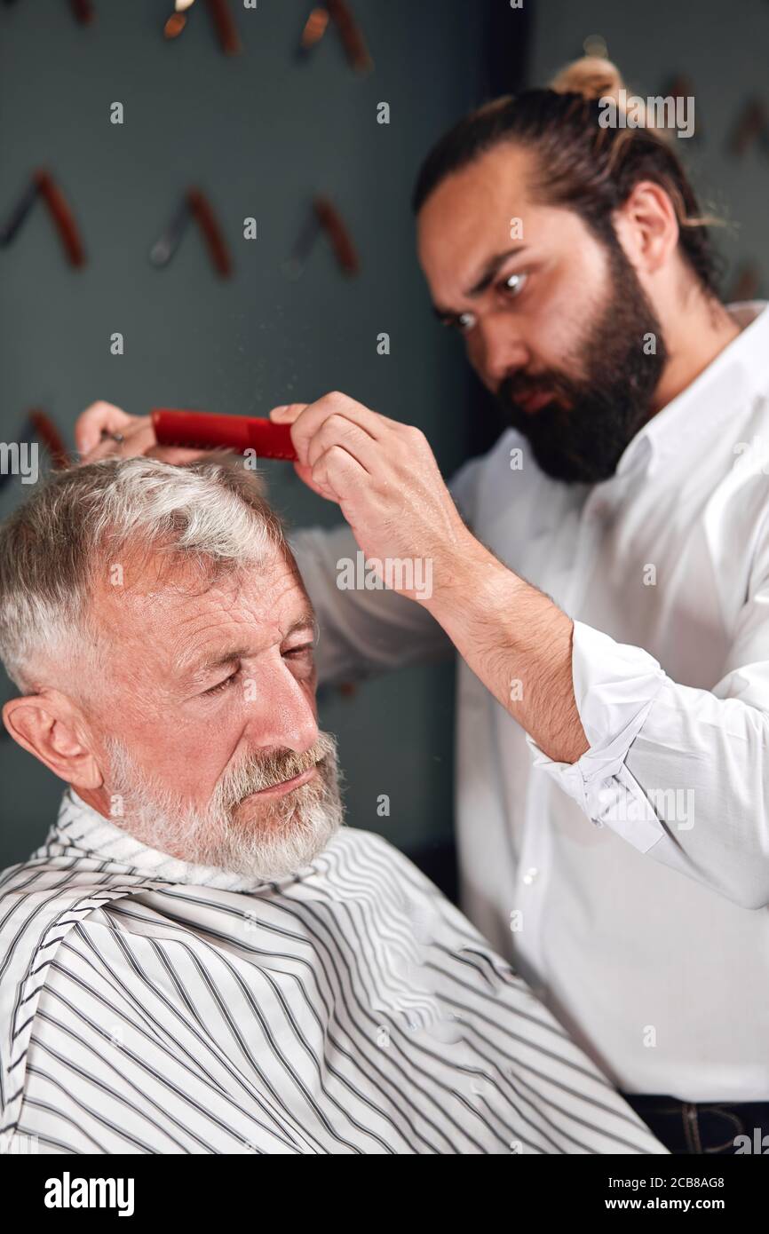 professional talented barber making haircut, close up photo Stock Photo ...
