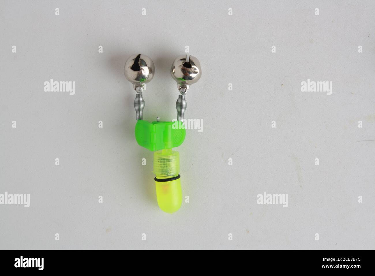 Overhead shot of a colorful fishing rattle on white background Stock ...