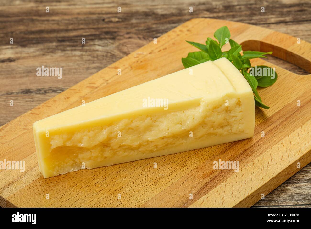 Hard parmesan cheese served basil leaves Stock Photo - Alamy