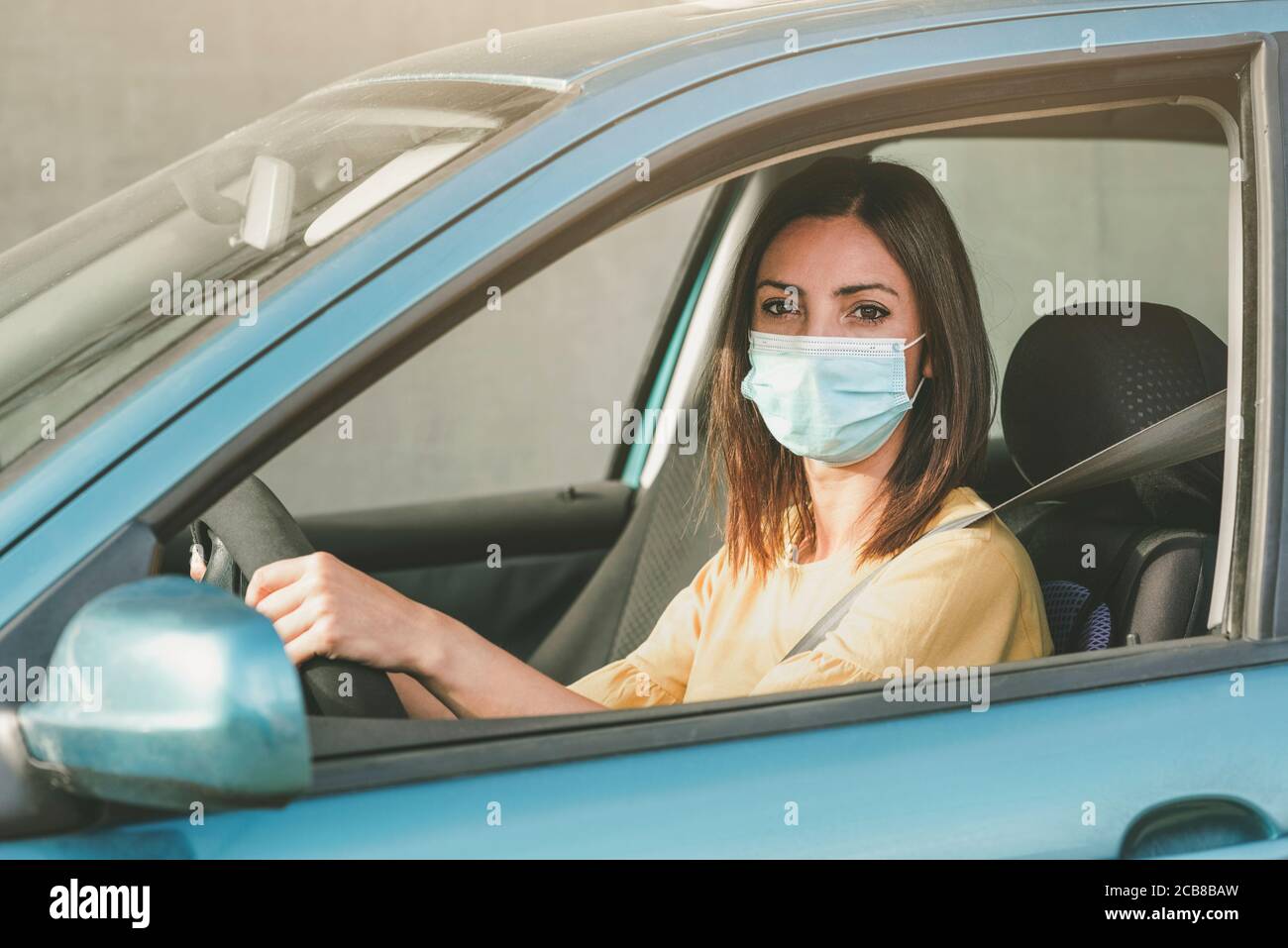 Woman face mask car hi-res stock photography and images - Alamy