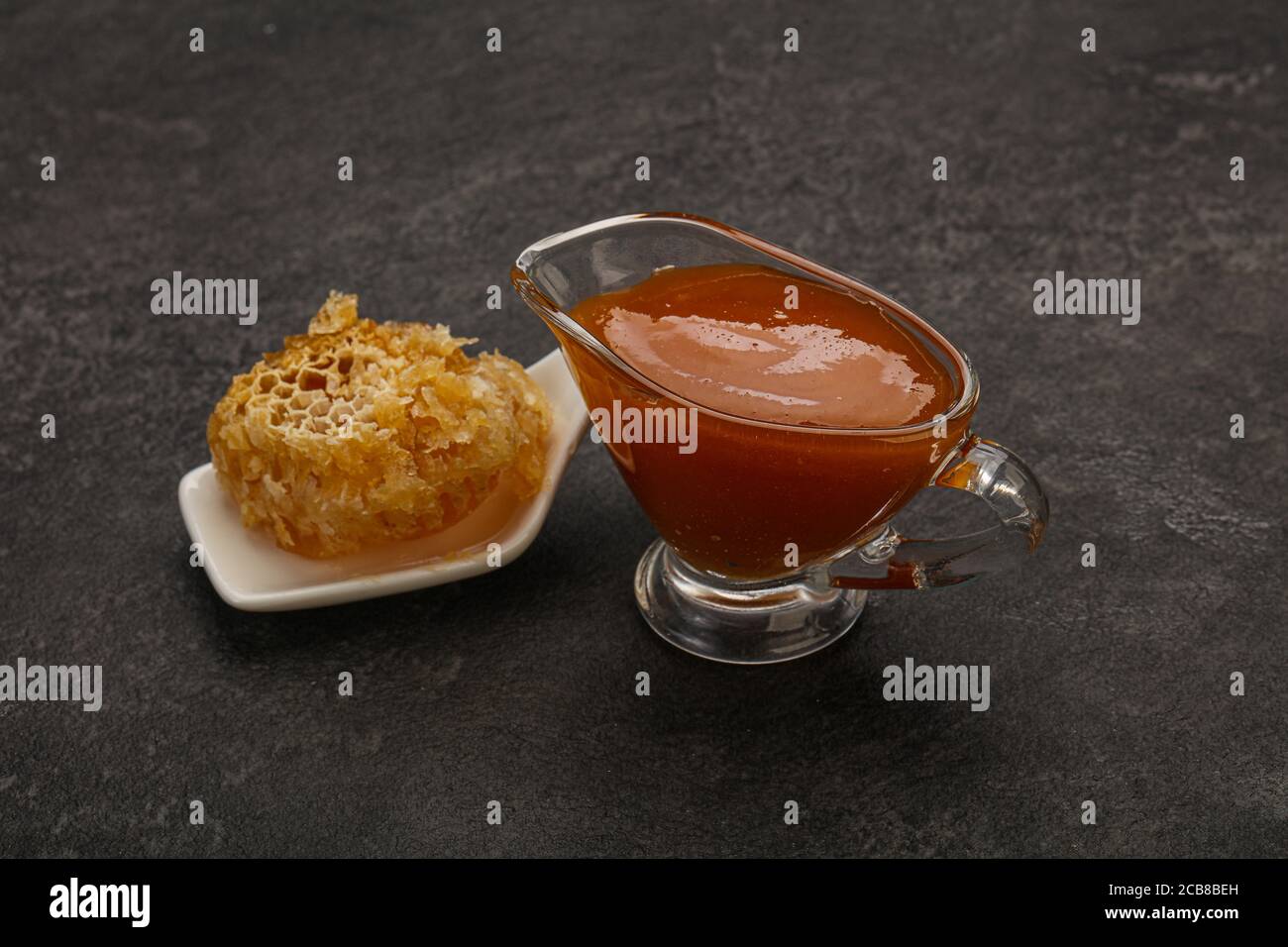 Natural tasty honey in the bowl Stock Photo - Alamy