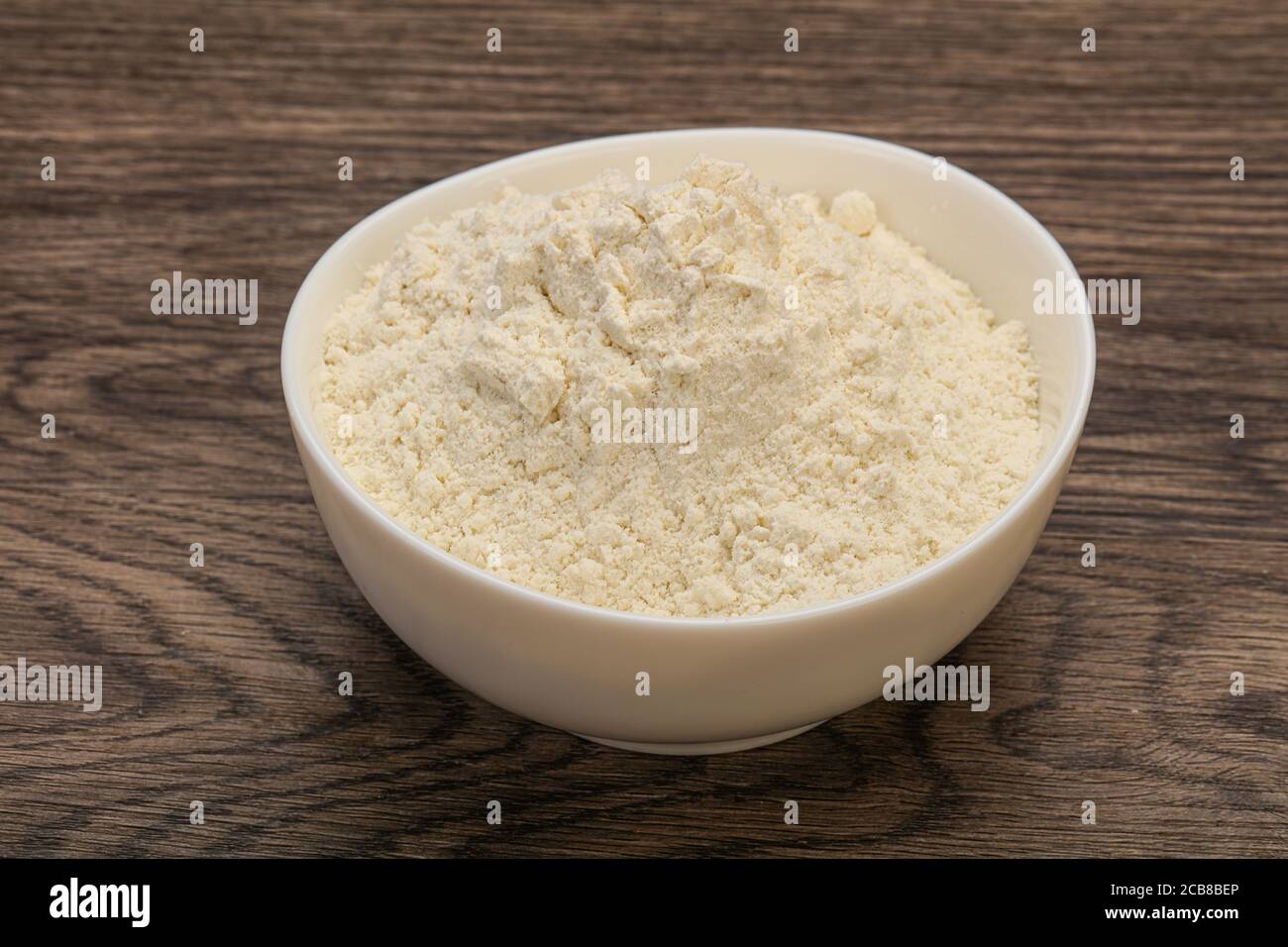 Wheat flour heap in the bowl for cooking Stock Photo - Alamy