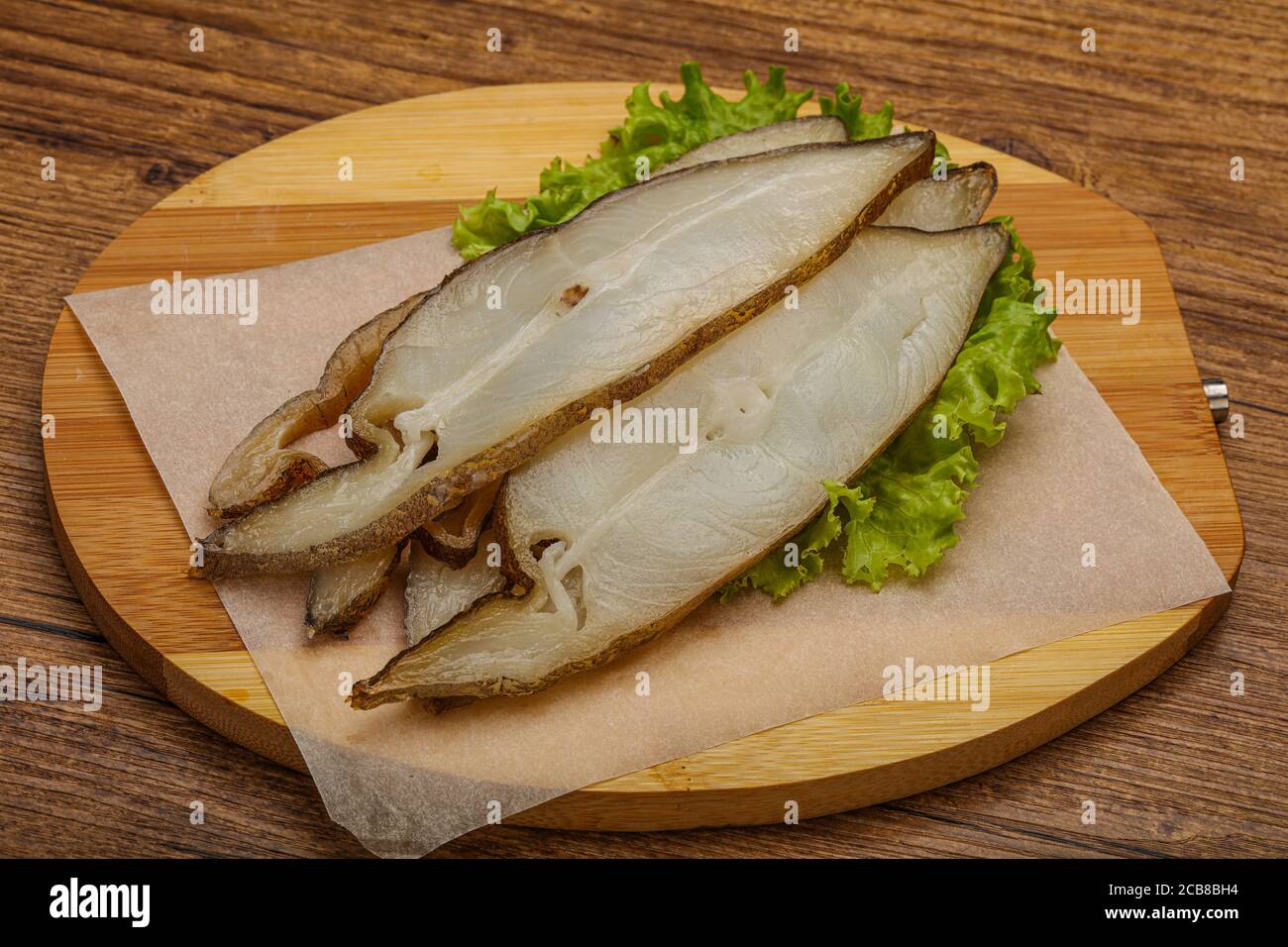 Delicous smoked halibut fish slices snack Stock Photo - Alamy