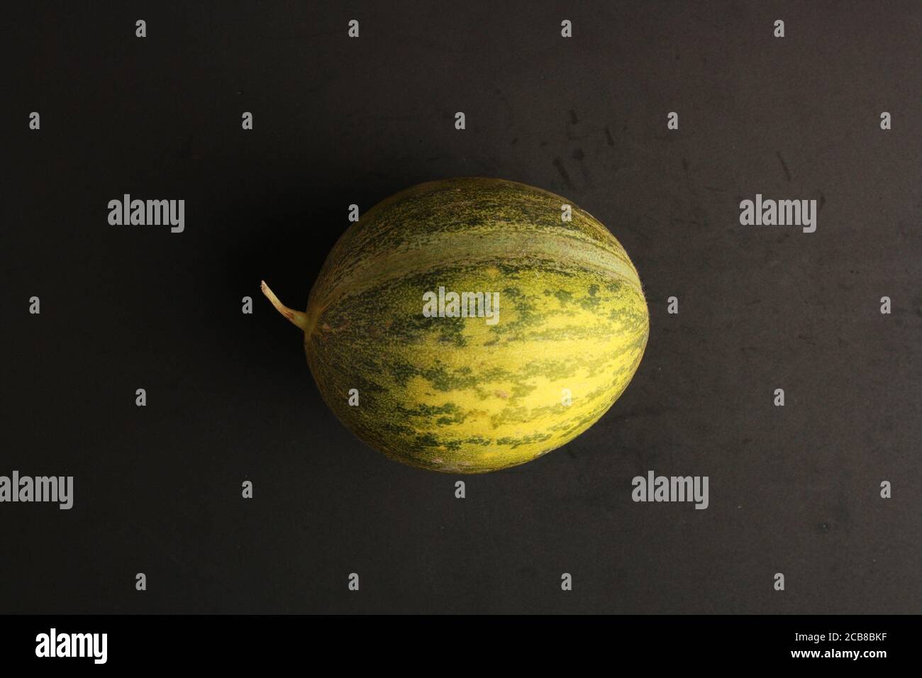 Organic watermelon isolated on a black background Stock Photo - Alamy