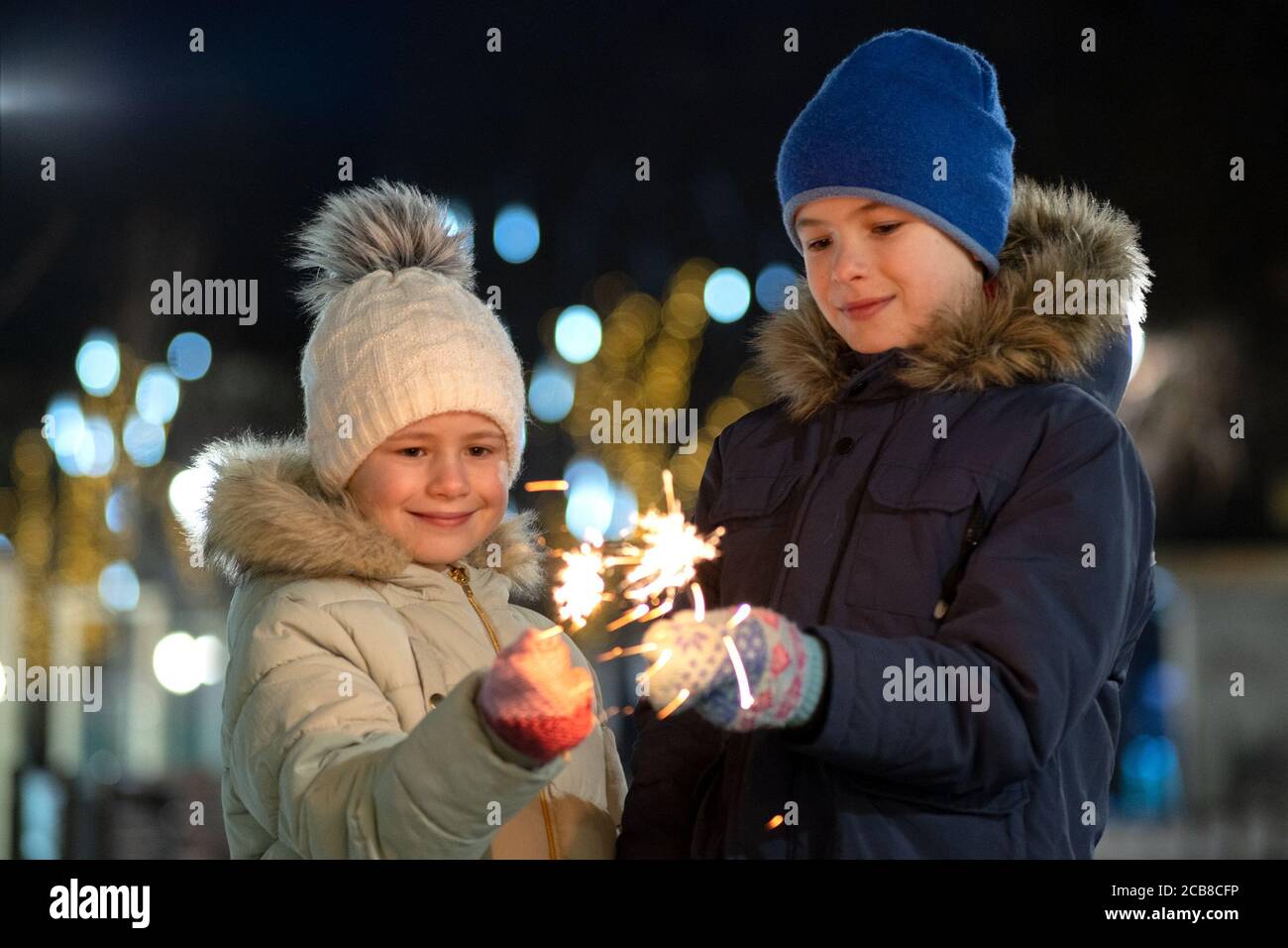Boy holding fireworks sparklers hi-res stock photography and images - Alamy