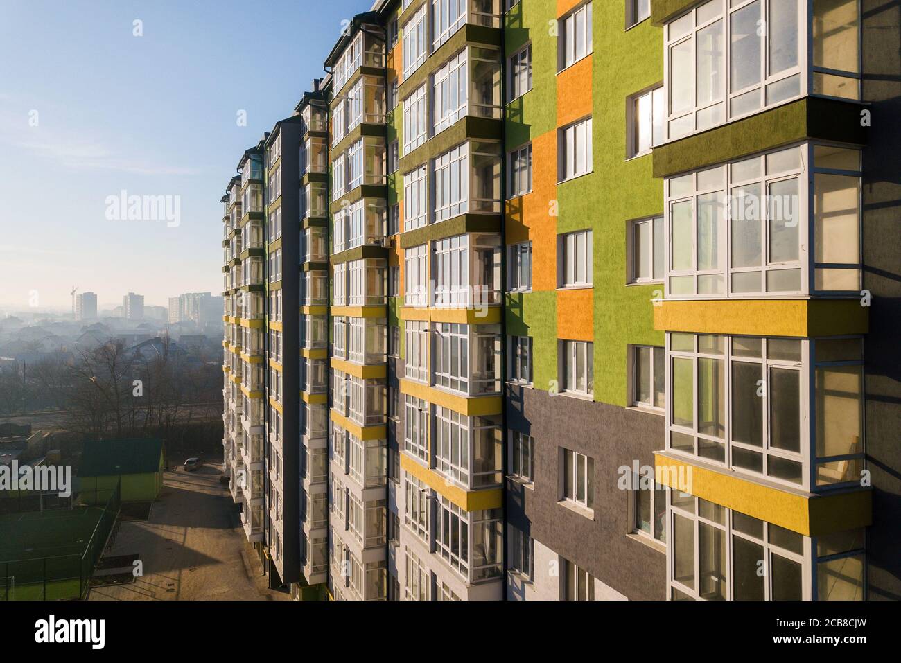 Aerial view of a tall residential apartment building with many windows ...