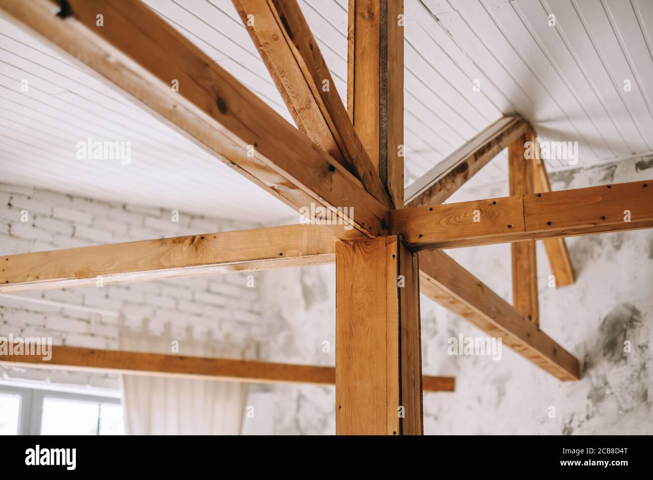 The construction of the wooden roof. Detailed photo of a wooden roof ...