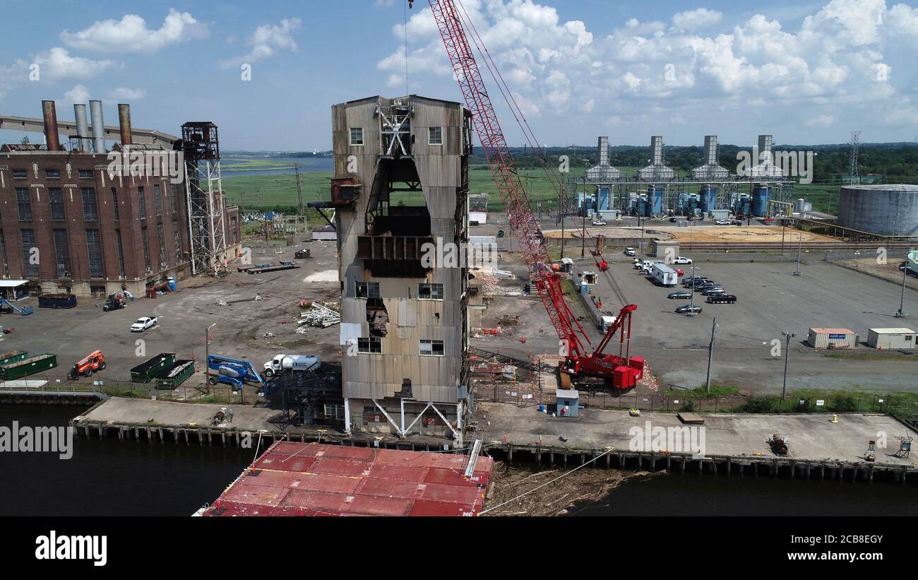 Aerial view of crane dismantling part of old power plant in Sayreville ...