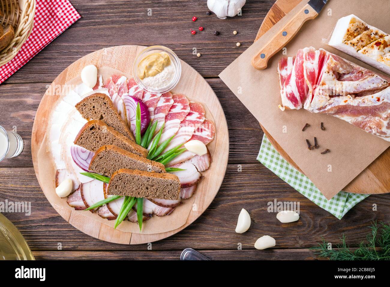 Vodka snack. Pork lard and bacon on a wooden board Stock Photo - Alamy