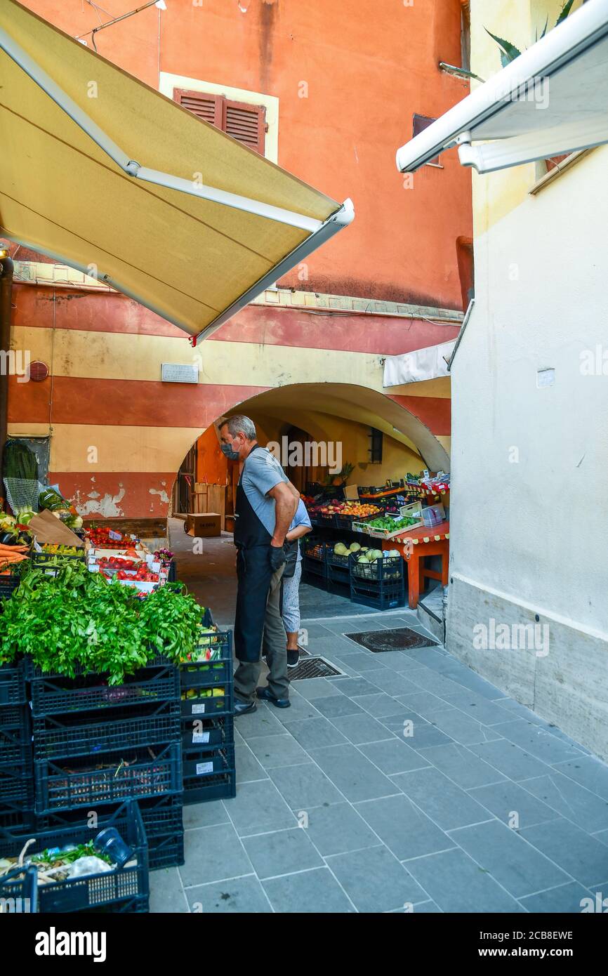 Exterior of a grocery store with fruit and vegetables displayed in a ...