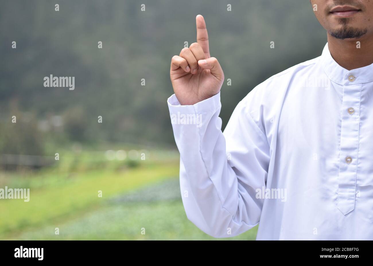 a man's hand with a tawhid symbol Stock Photo - Alamy