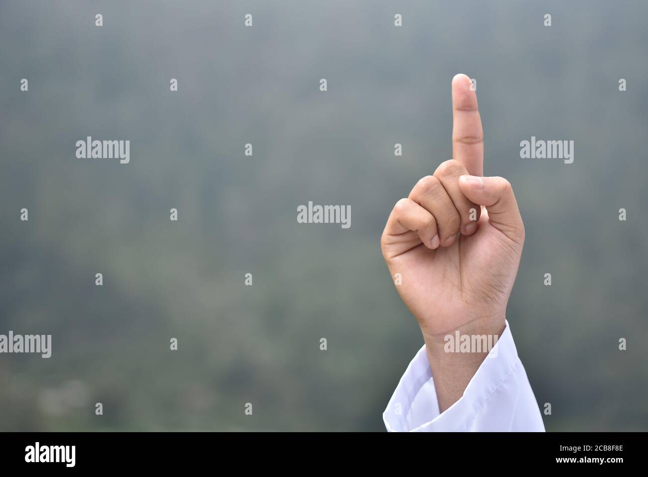 a man's hand with a tawhid symbol Stock Photo - Alamy