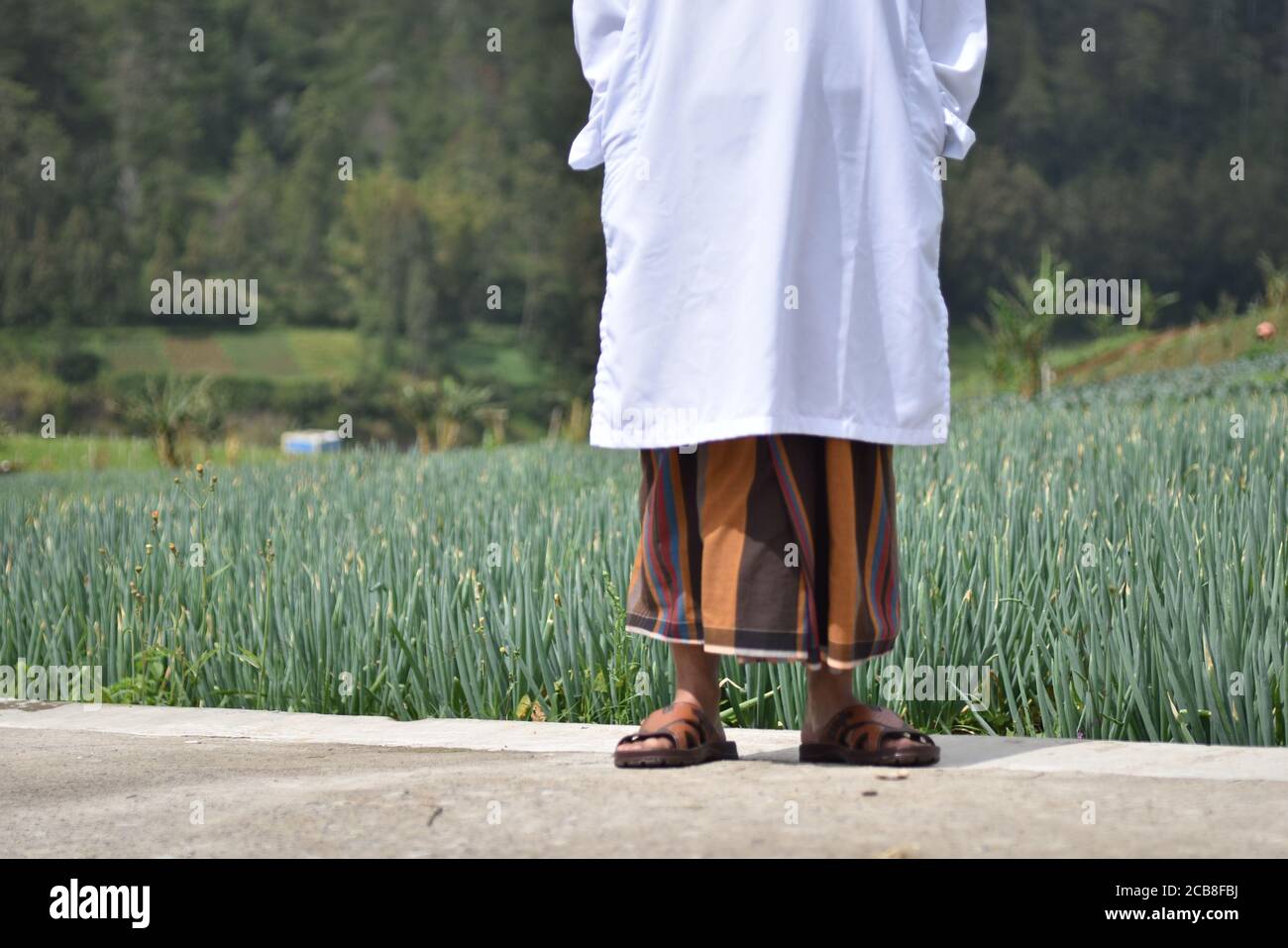 Muslim men wearing sarong are walking Stock Photo - Alamy