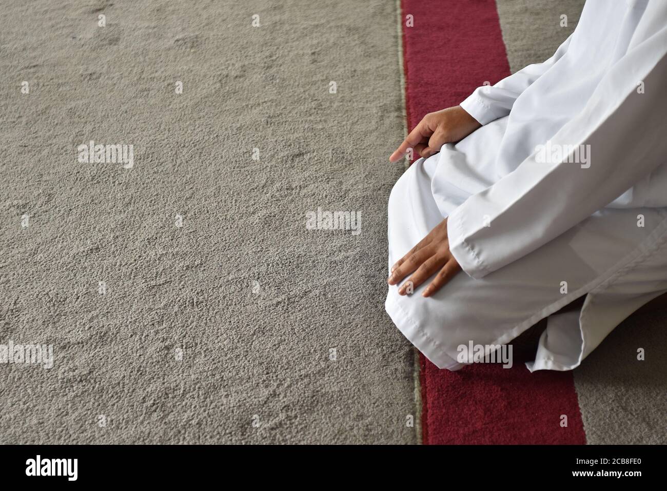 Muslim men praying in Tashahhud posture Stock Photo - Alamy