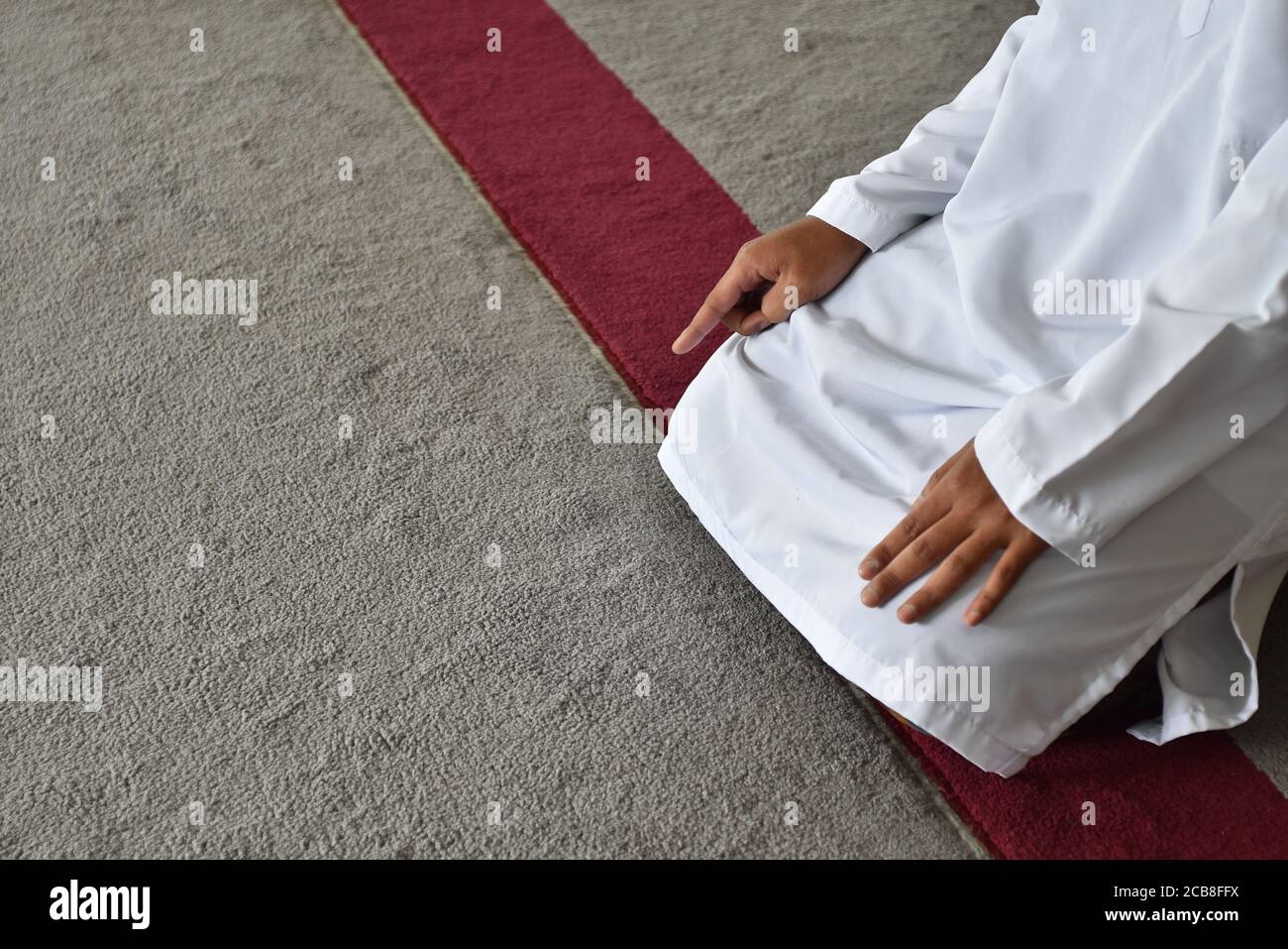 Muslim men praying in Tashahhud posture Stock Photo - Alamy