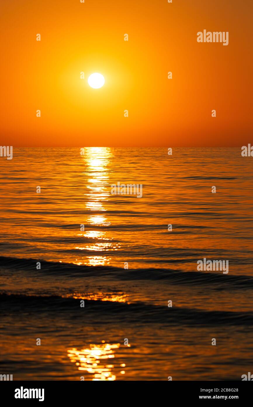 Beautiful sunrise over the sea. Morning at sea Stock Photo - Alamy