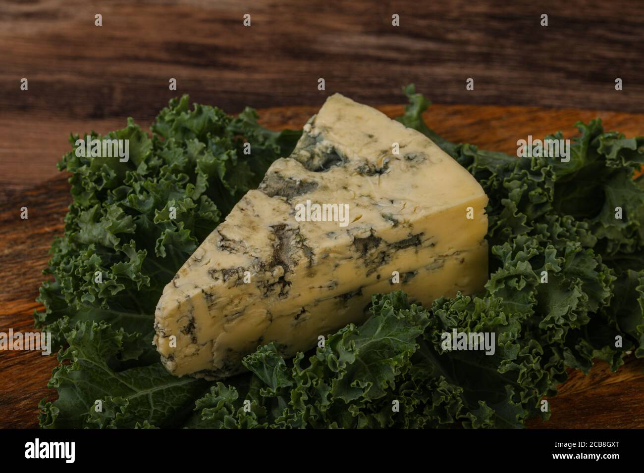 Dairy Blue cheese triangle with mold Stock Photo - Alamy