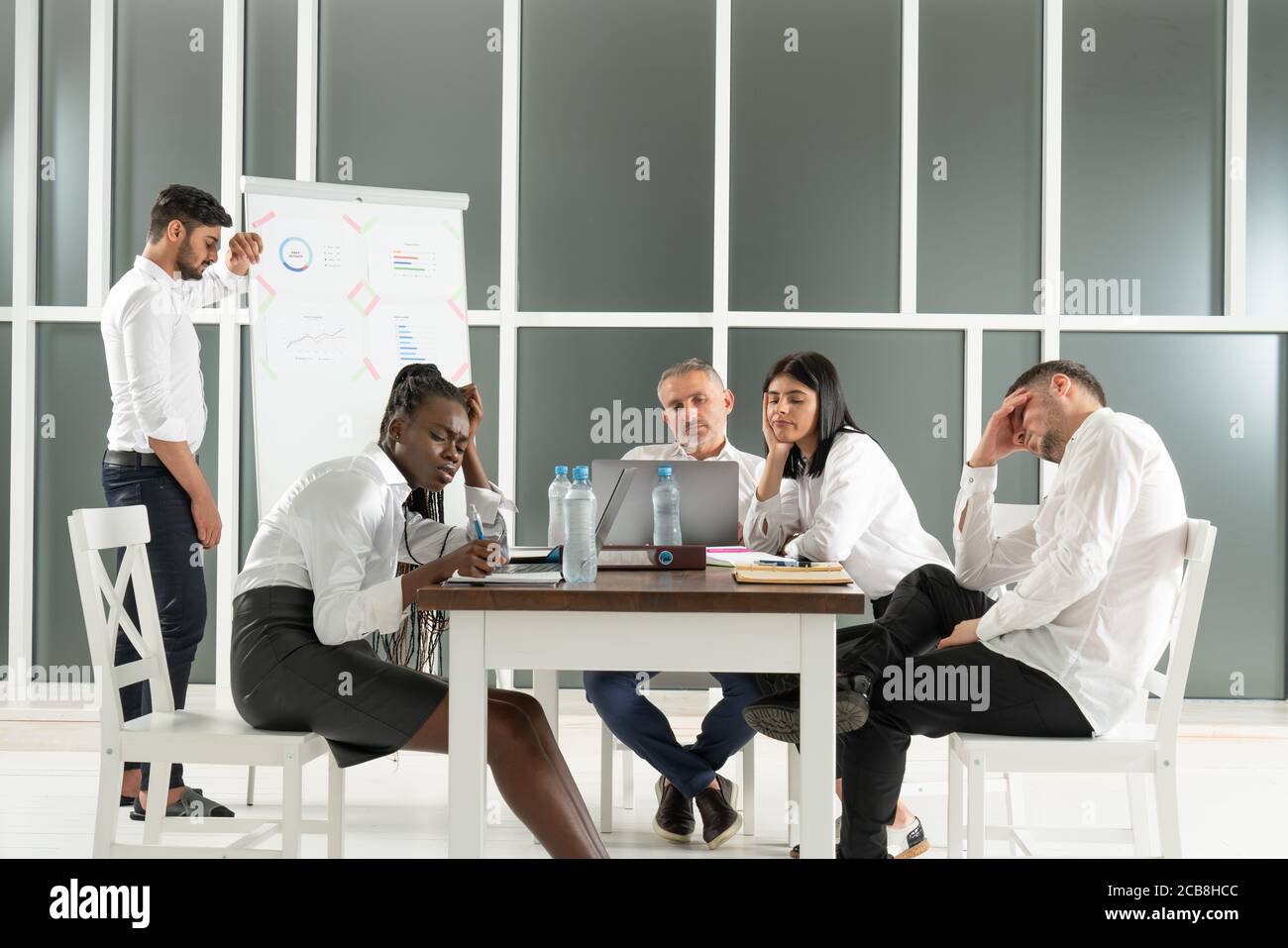 Business, teamwork, people and crisis concept - business team sitting ...