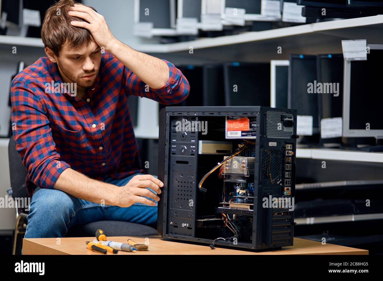 Confused looking computer technician hi-res stock photography and ...