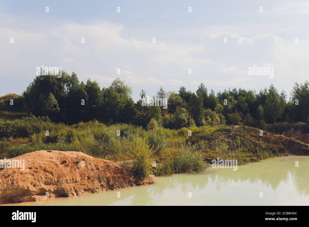Open pit asbestos quarry lake with blue water Stock Photo - Alamy