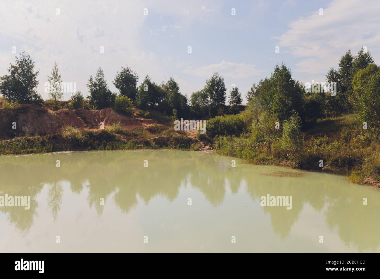 Open pit asbestos quarry lake with blue water Stock Photo - Alamy