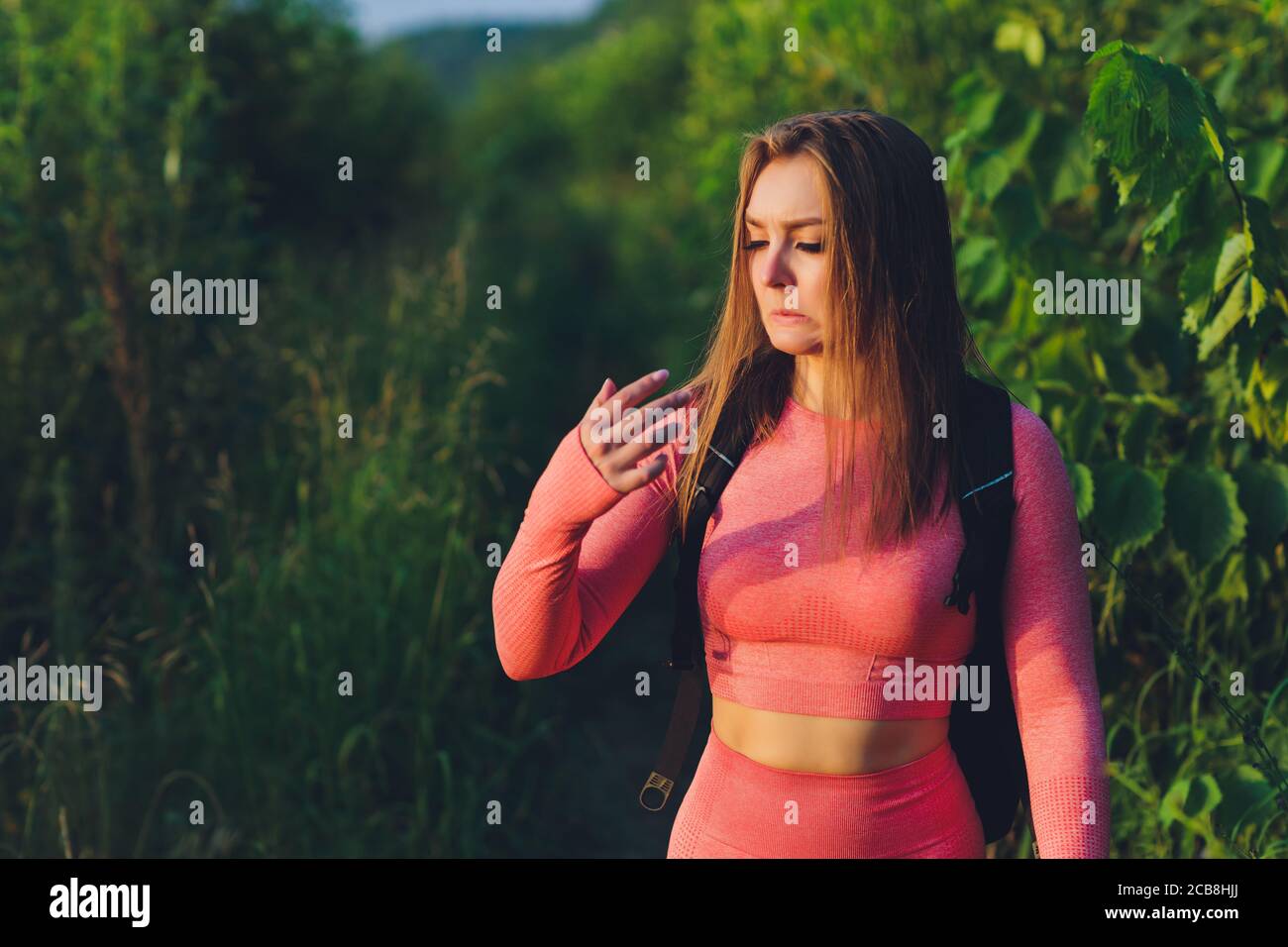 A woman with a sad suffering face shows a finger on which there is a ...