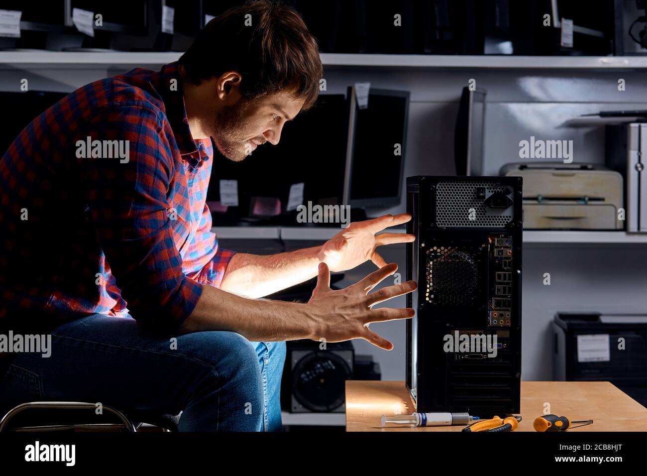 hardware problem concept.funny man using magic skills while repairing a ...