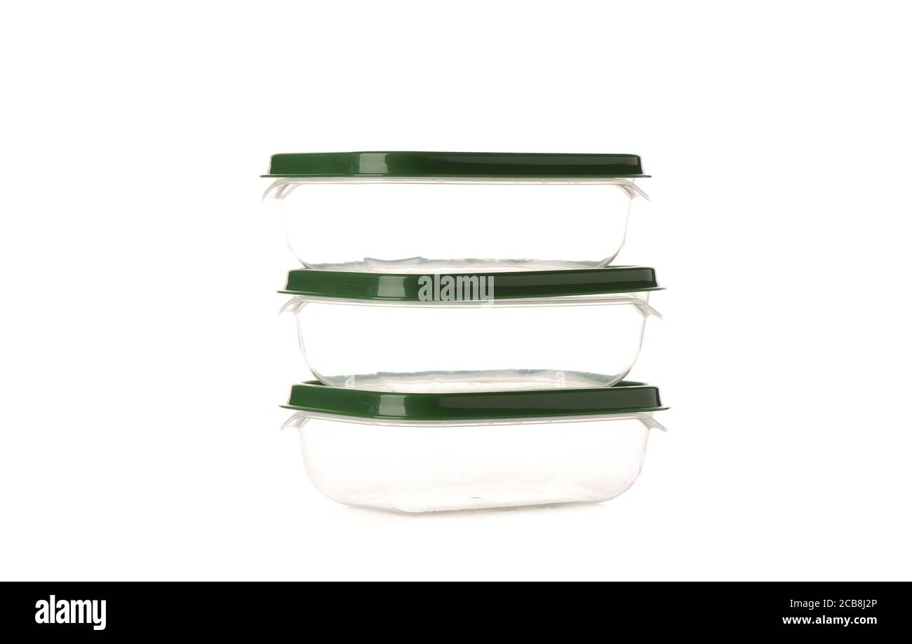 Plastic containers with a green lid for storing food, isolated on a ...